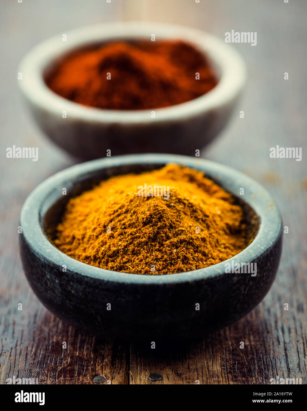 Curry powder and chili pepper in small containers Stock Photo - Alamy