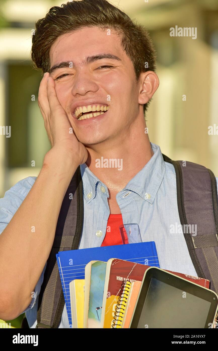 Happy Handsome Filipino Male Student With Books Stock Photo - Alamy