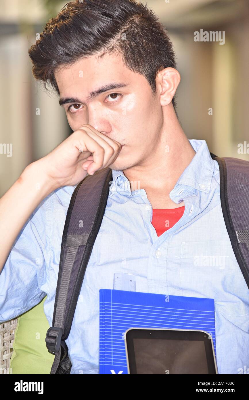Asian school boy looking worried hi-res stock photography and images ...
