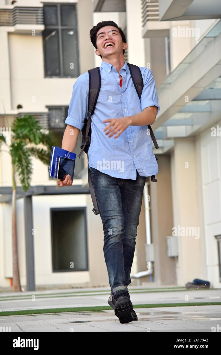 Boy Student Having Fun Walking On Campus Stock Photo - Alamy