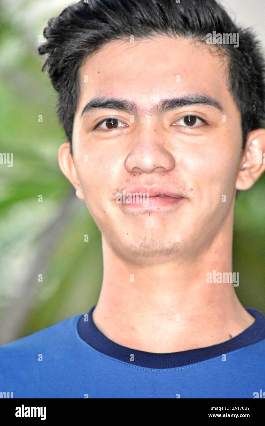 A Serious Young Asian Person Stock Photo - Alamy