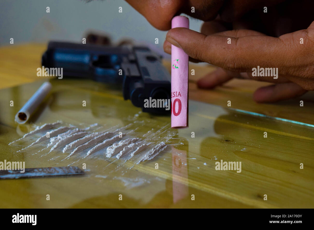 Cocaine ready for uses on wooden table. Cocaine Drug Addiction Concept ...
