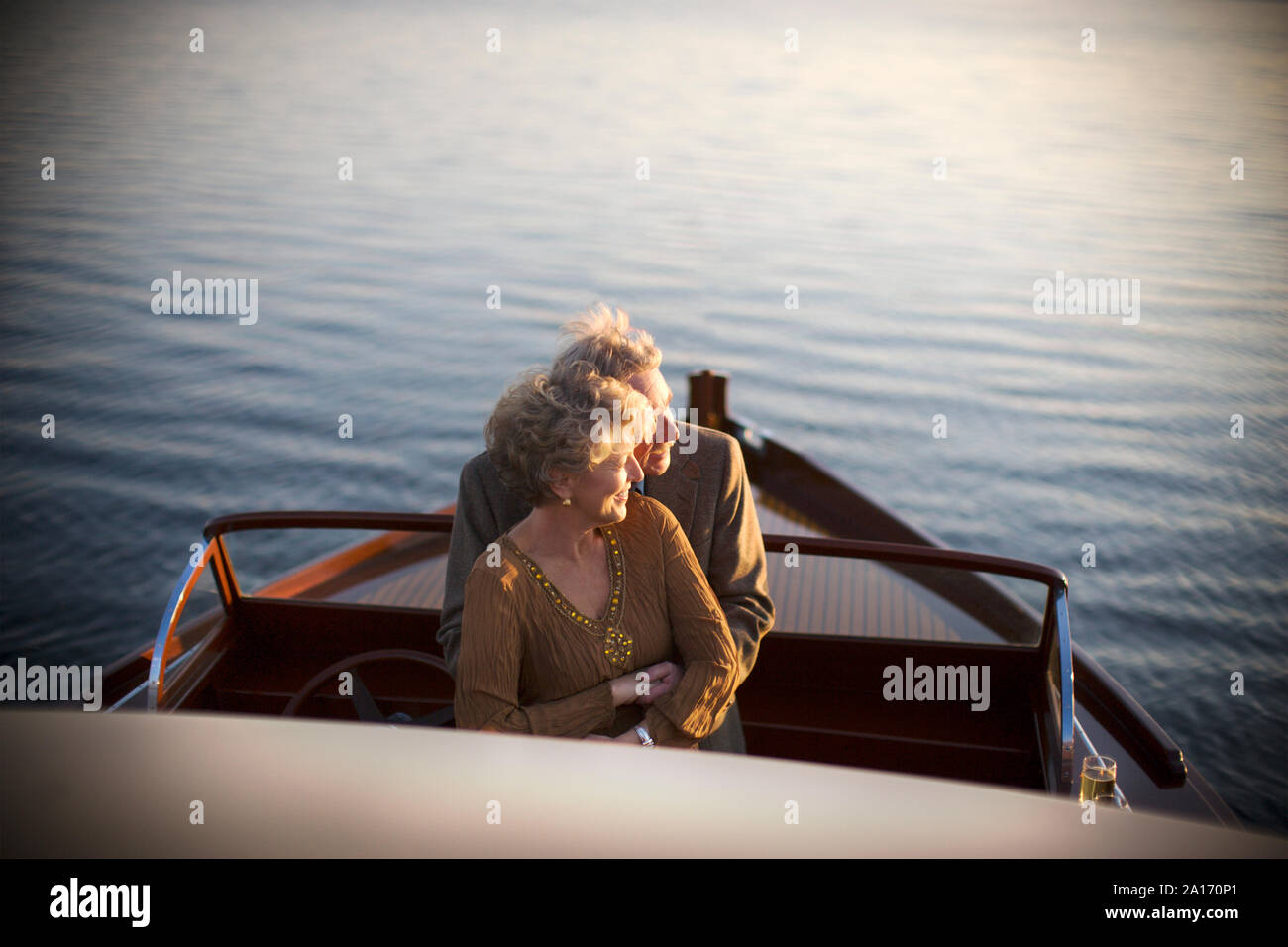 Couple hugging on boat Stock Photo - Alamy