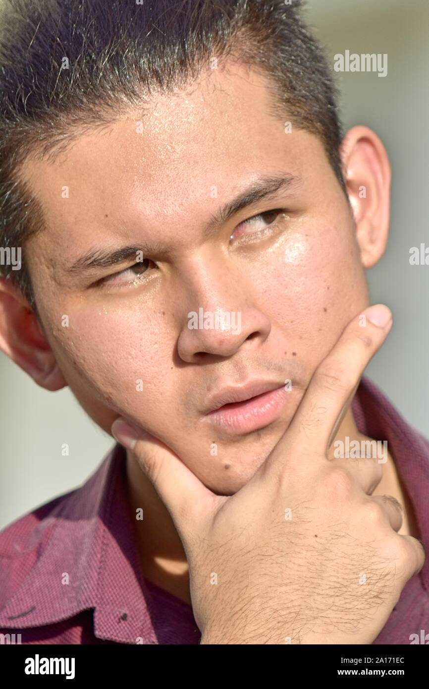 A Thoughtful Handsome Asian Male Stock Photo - Alamy