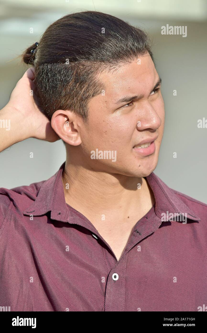 A Confused Young Diverse Male Stock Photo - Alamy