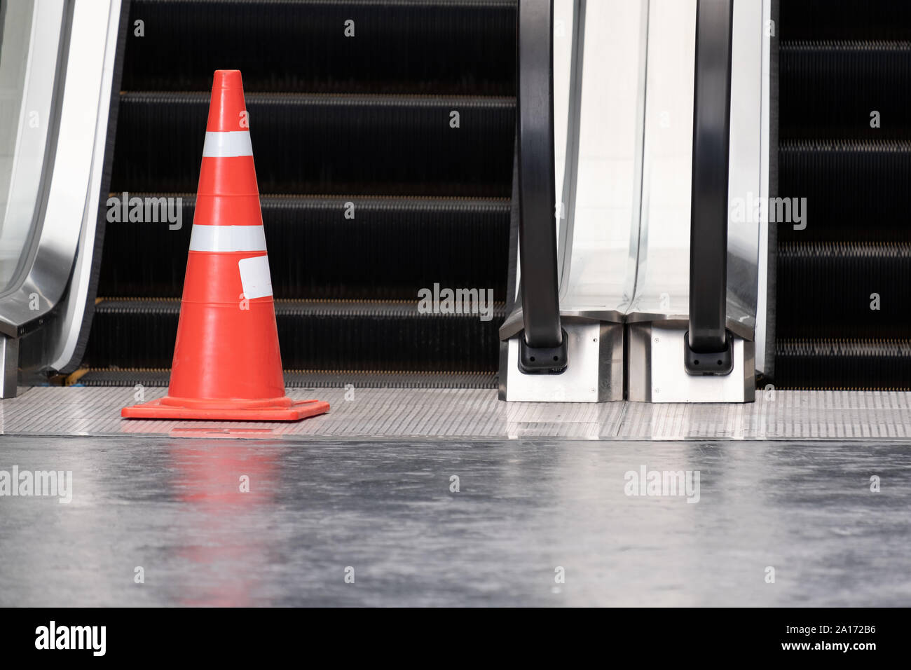 street cone block escalator for maintenance Stock Photo - Alamy