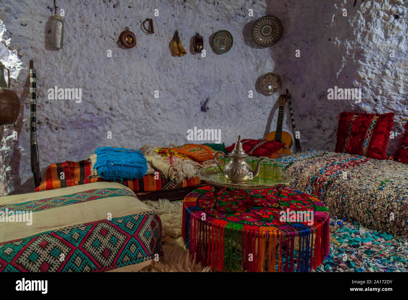 traditional berber cave home morocco with rug furnishing and colourful ...