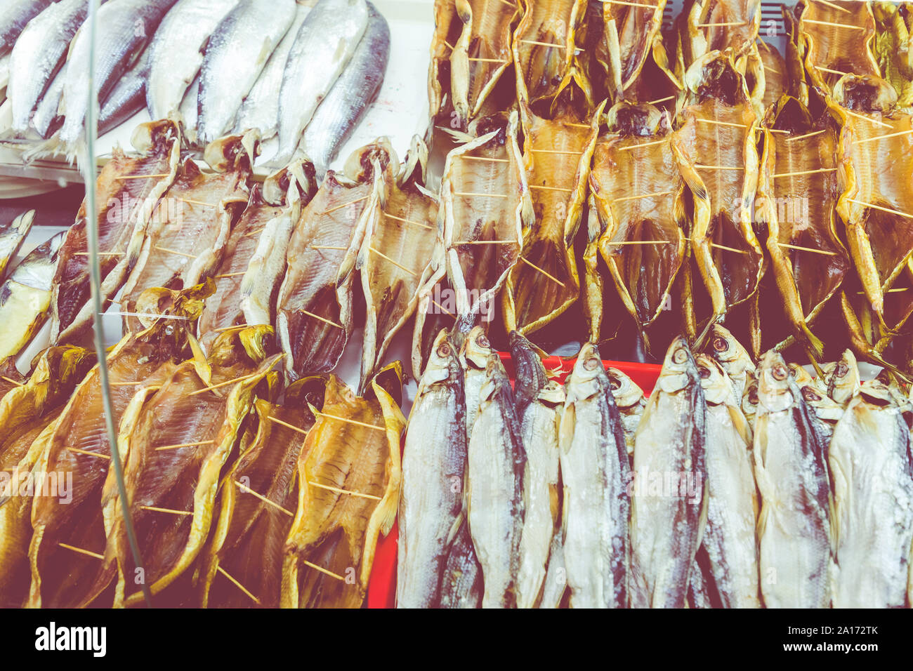 Dried fish Omul lying on the counter in Listvyanka, Lake Baikal ...