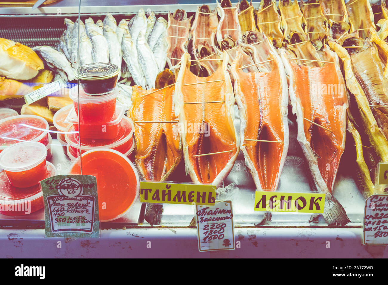 Dried fish Omul lying on the counter in Listvyanka, Lake Baikal ...