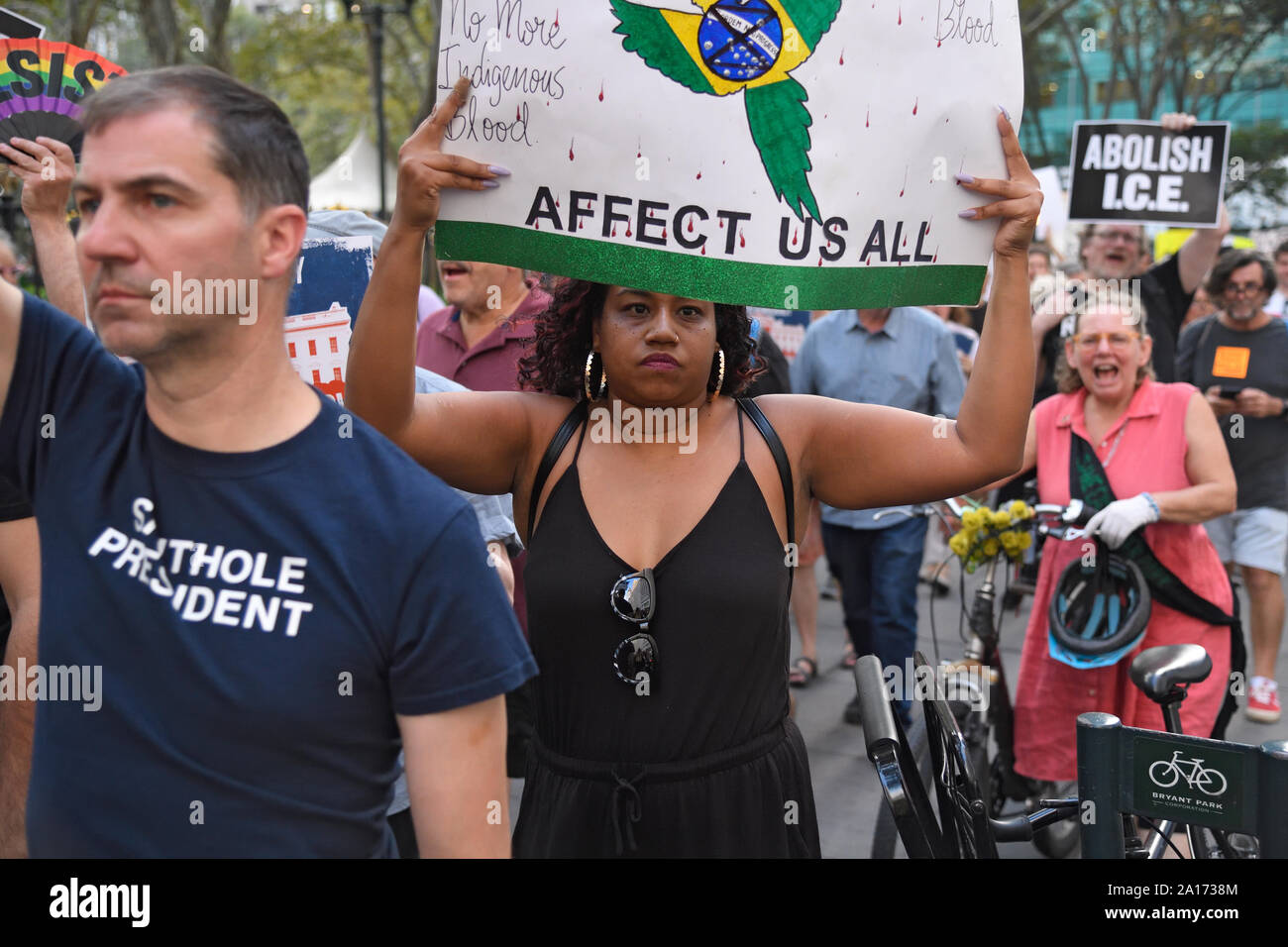 Protester shows off her placard during the Rise and Resist - United in ...