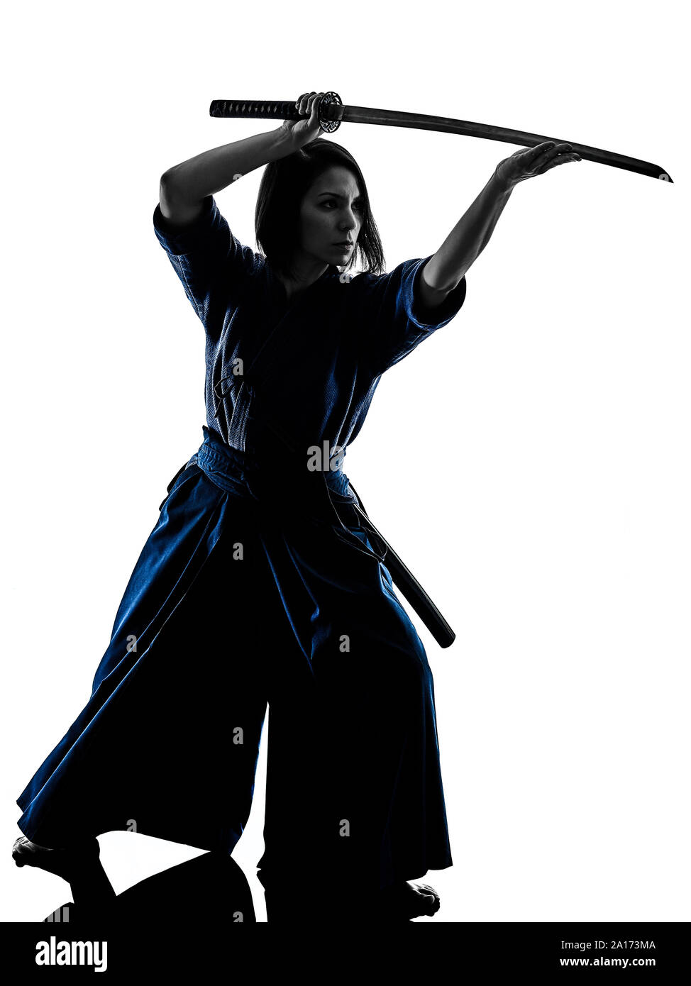 one caucasian woman practicing laido Katori Shinto ryu shadow ...