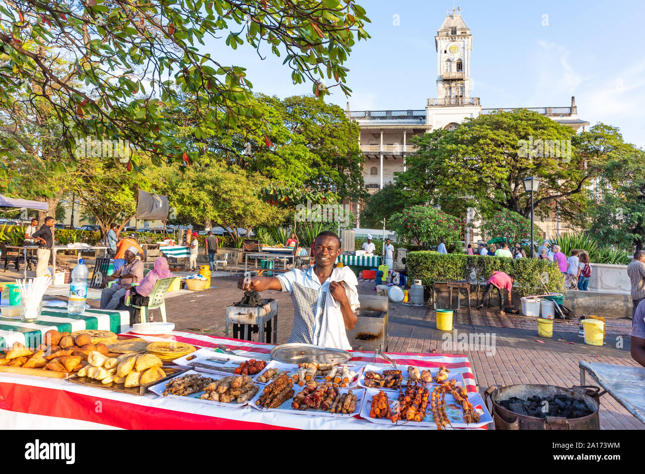 Stone Town , Zanzibar-February 28, 2019 : Man smiling serving street ...