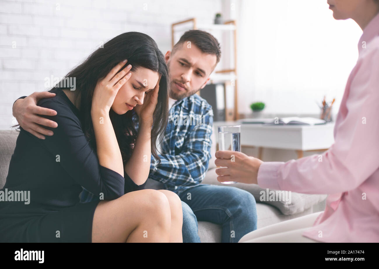 Woman suffering from acute headache at psychological consultation Stock ...