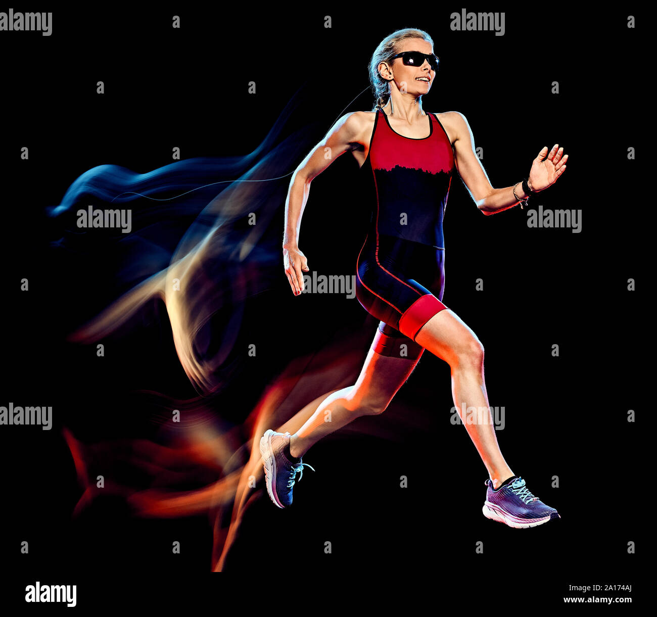 one caucasian woman triathlon triathlete runner running joogger jogging ...