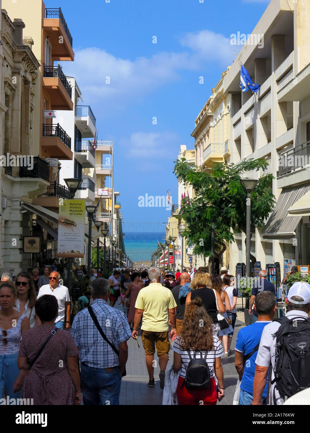 People, local and tourists, walking along 25th August street, Heraklion ...
