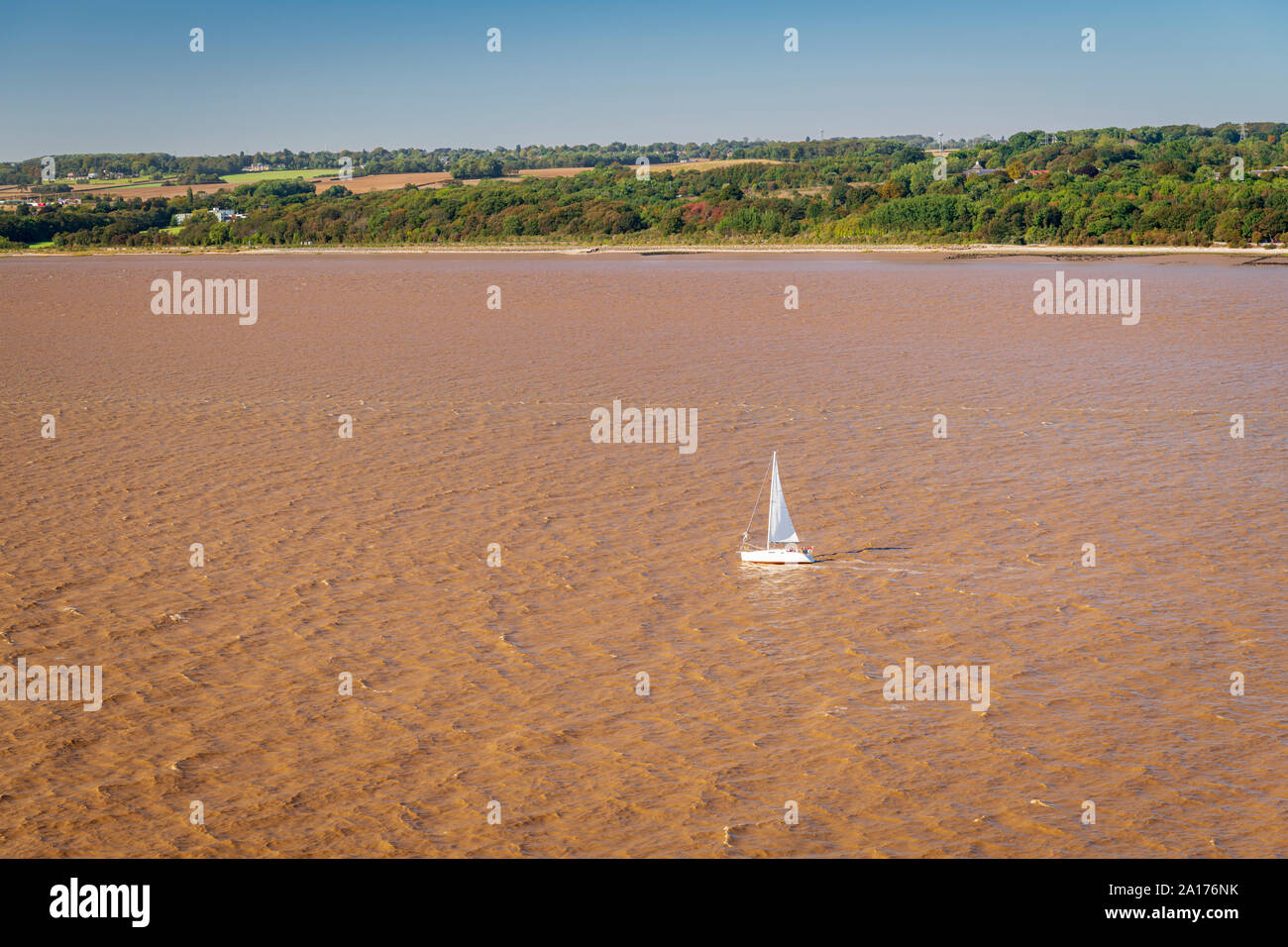 An image of a small yacht on the muddy River Humber taken from the west ...