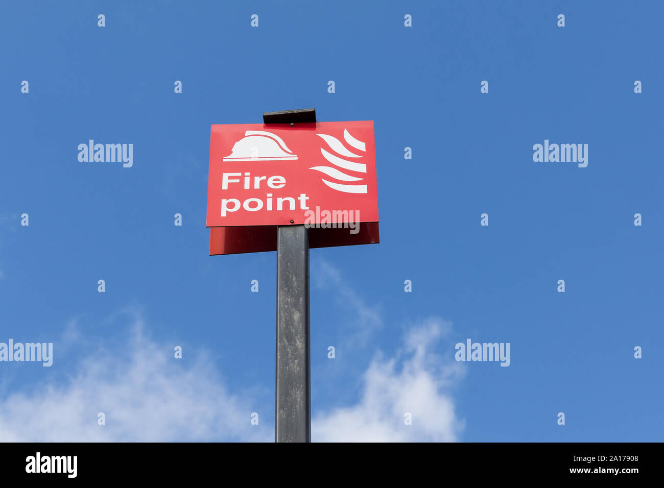 Fire point sign against blue sky Stock Photo - Alamy