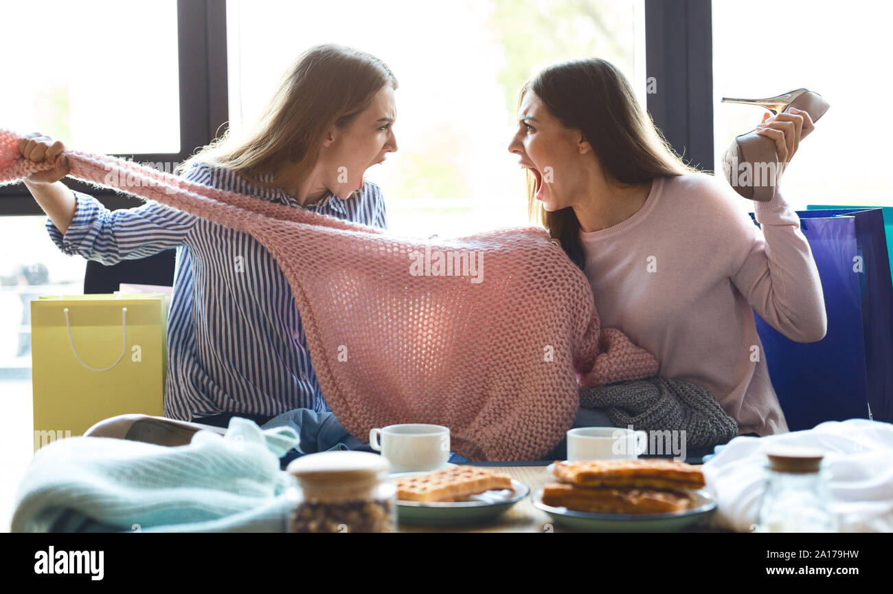 Grabbing clothing hi-res stock photography and images - Alamy