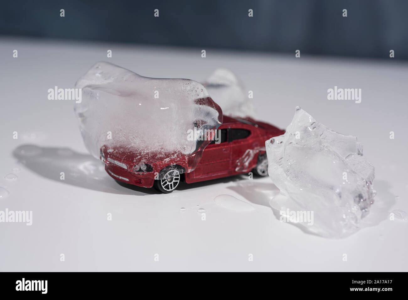 Frozen small red car in ice. Abstract winter driving concept Stock ...