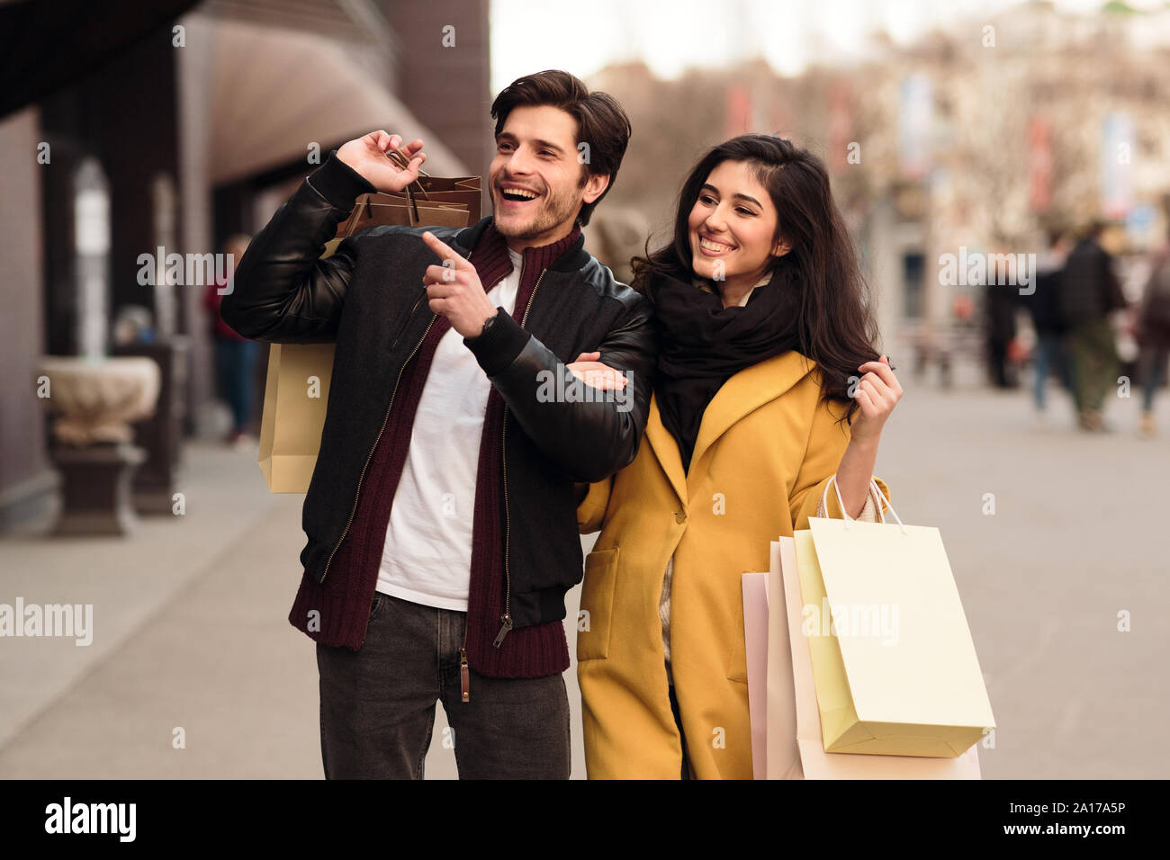 Wow sales. Guy pointing on shopwindow, shopping wih wife Stock Photo ...