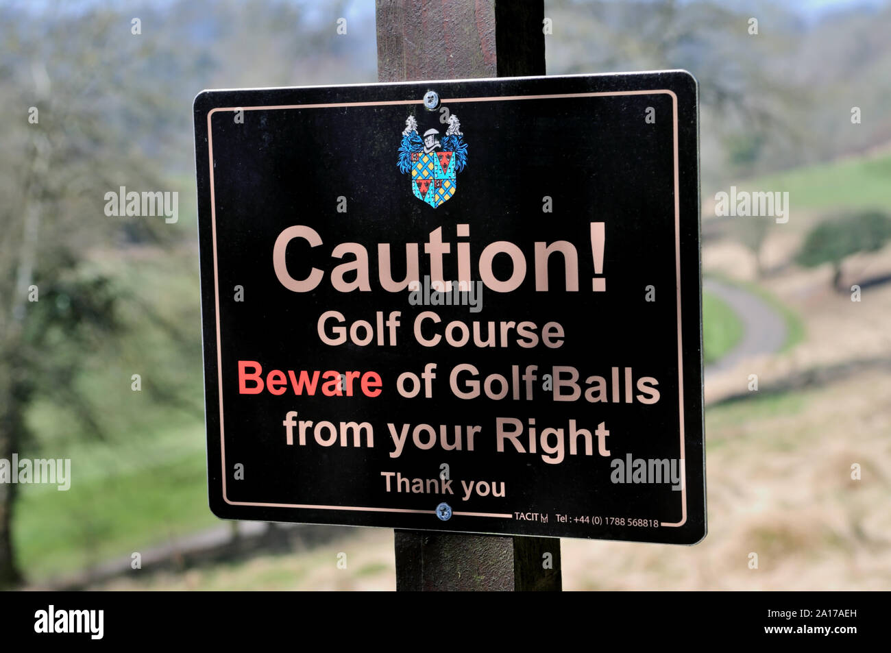 A warning notice on a public footpath entering a golf course Stock ...