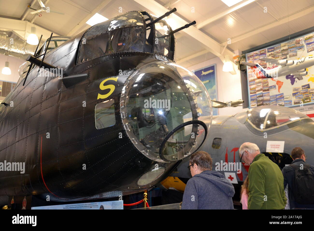 Visitors look at a Lancaster bomber, one of the exhibits on display at ...