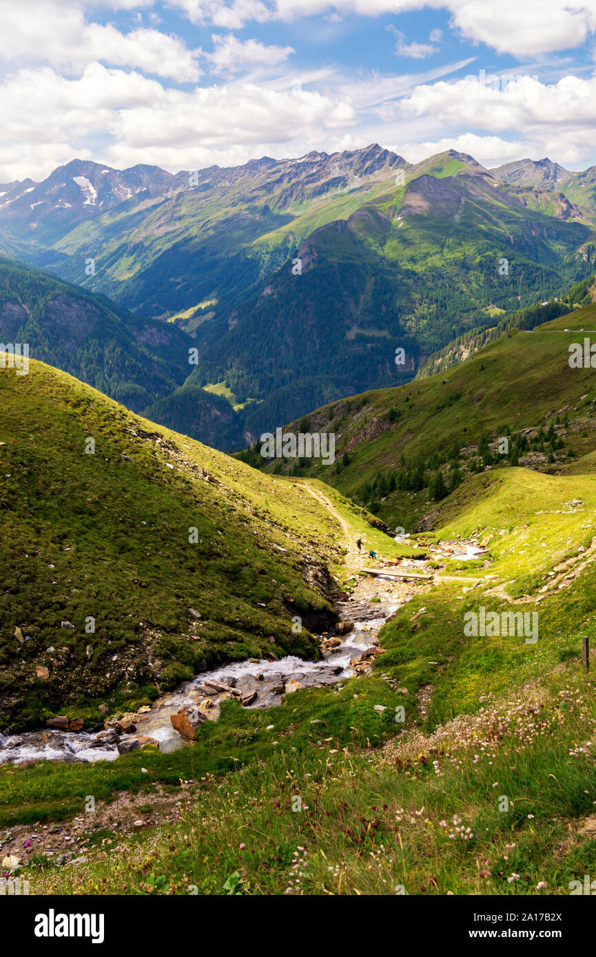 Mountain river and picturesque slopes of the Austrian Alps in summer ...
