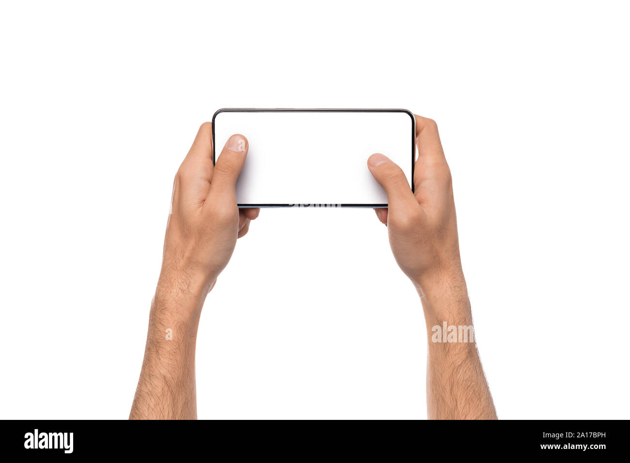 Male hands holding smartphone with blank screen, playing video games ...