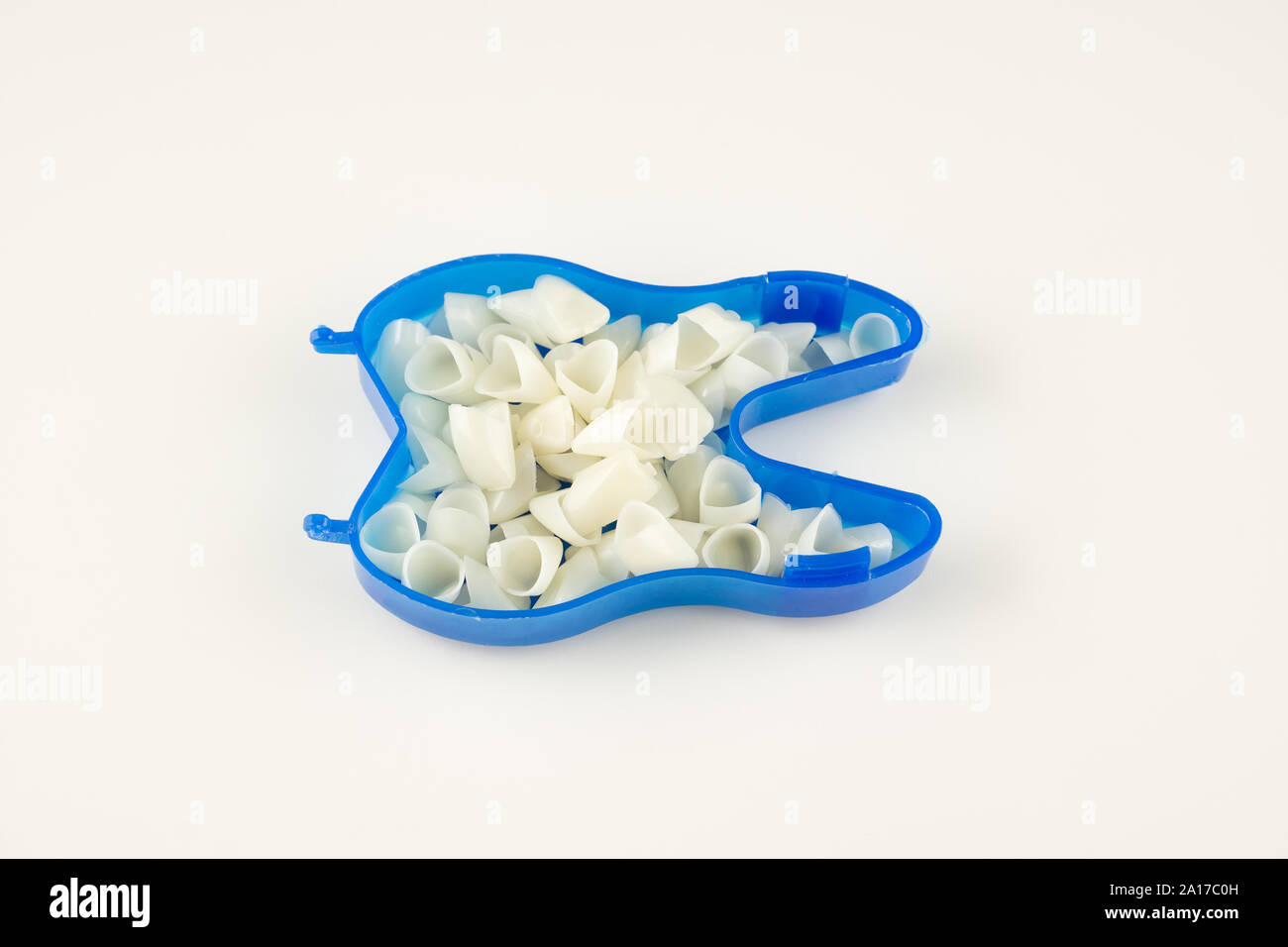 variety of artificial temporary dental crowns isolated on white ...
