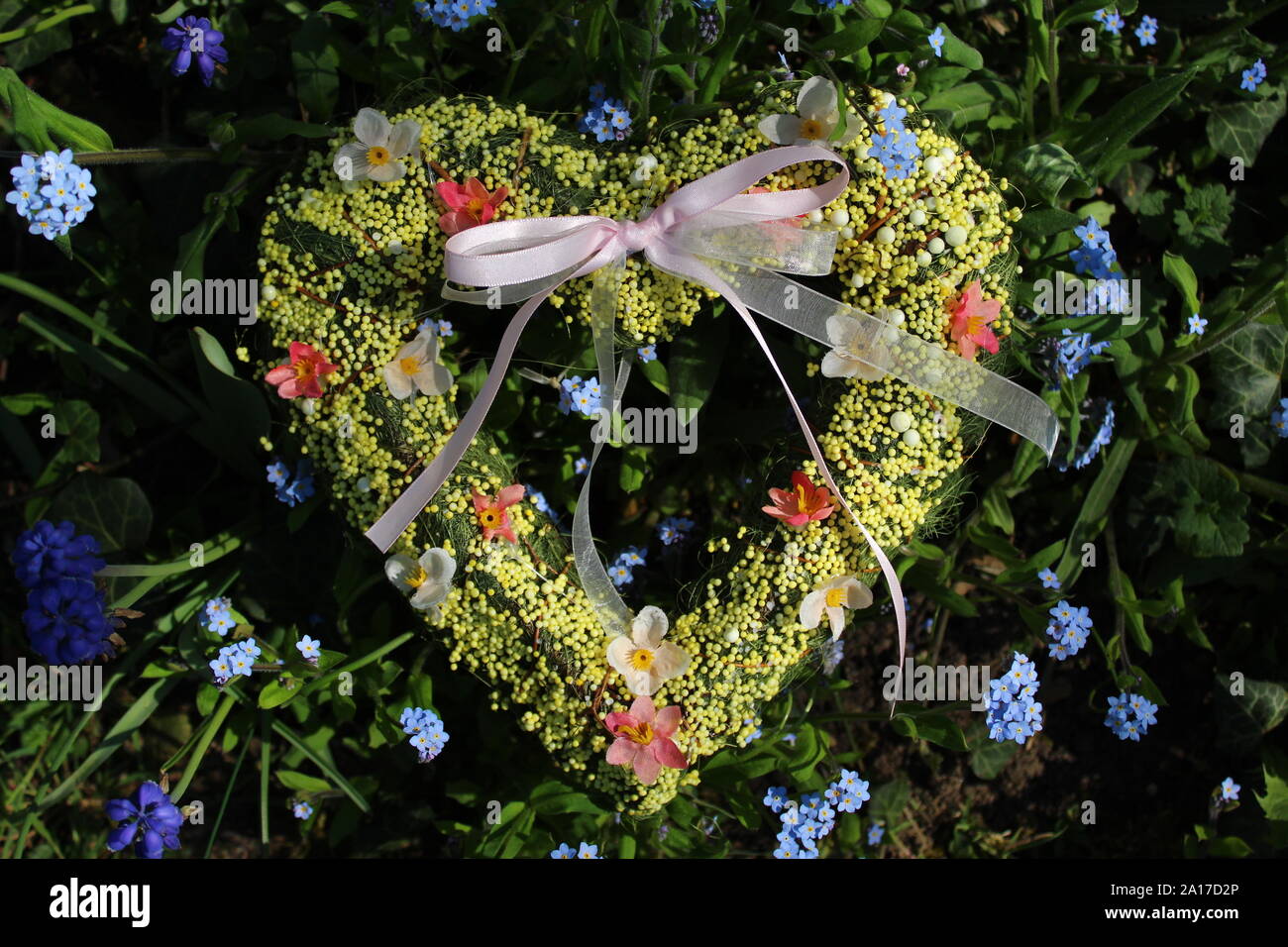 The pictureshows a romantic heart in spring flowers Stock Photo - Alamy