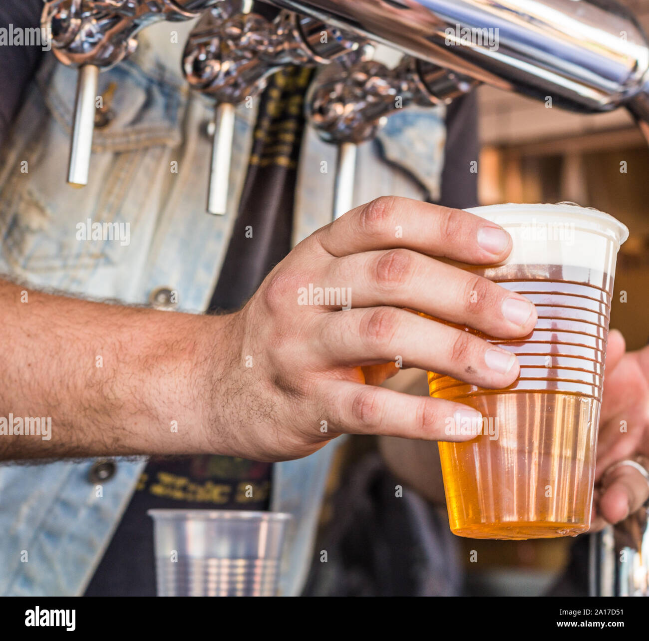 Serving cold beer at a street food market Stock Photo - Alamy