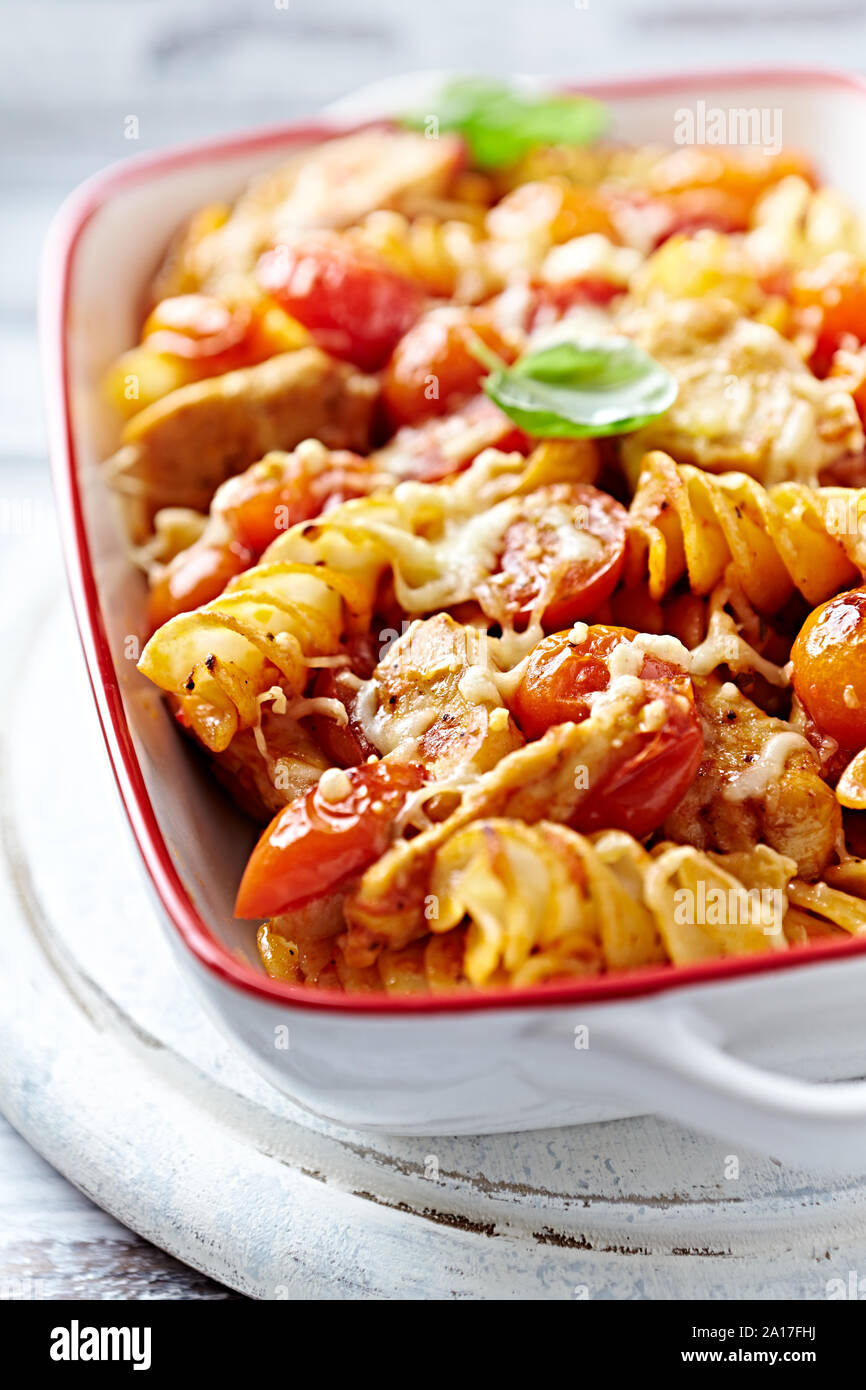 Baked fusilli with chicken and cherry tomatoes. Italian pasta Stock ...