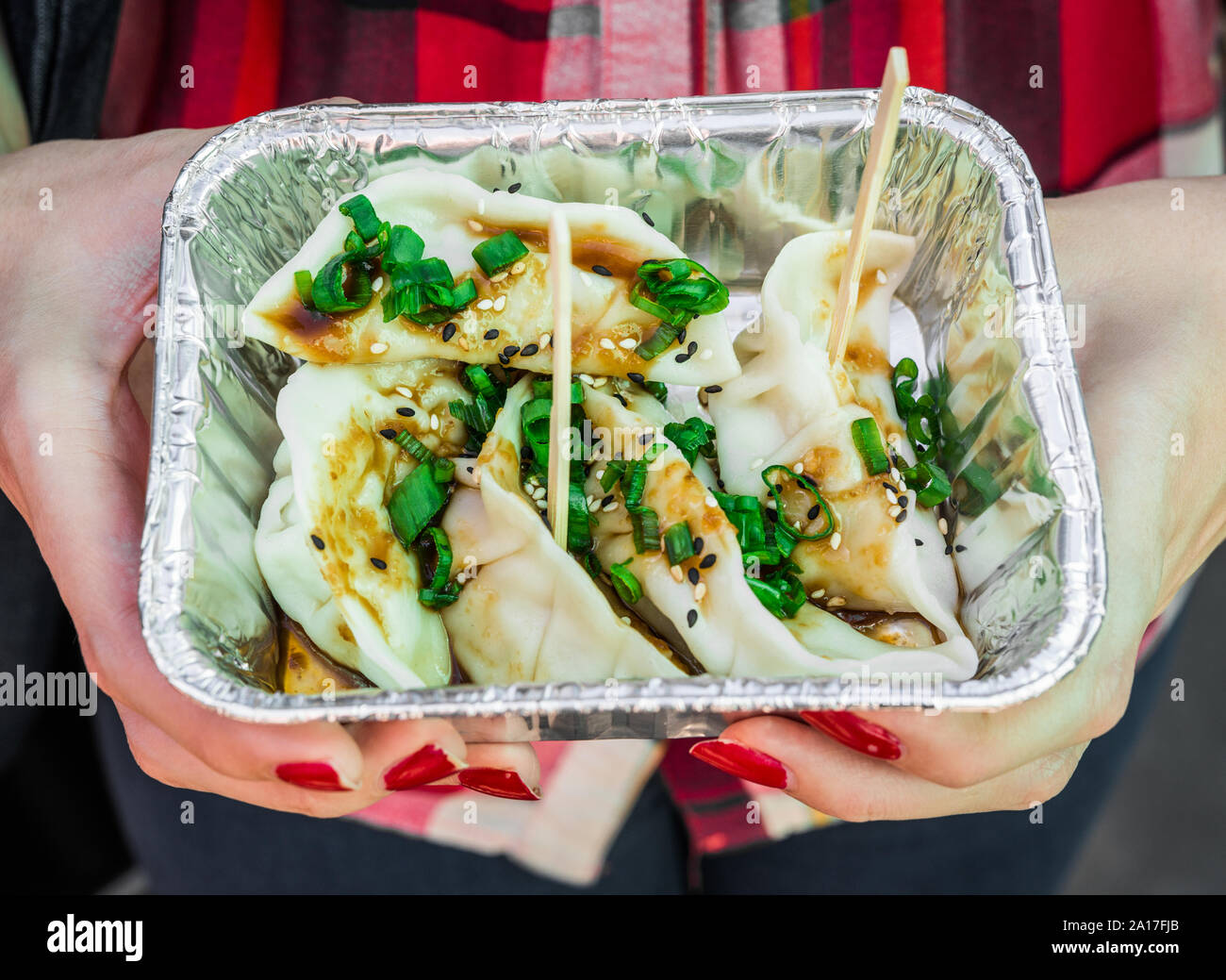 Gyoza dumplings with fish, Chinese and Japanese staple, at a street ...