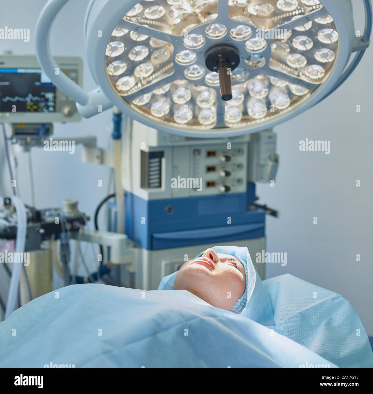 Several doctors surrounding patient on operation table during their ...