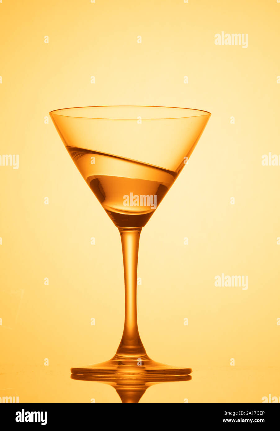 Martini glass on color background Stock Photo - Alamy