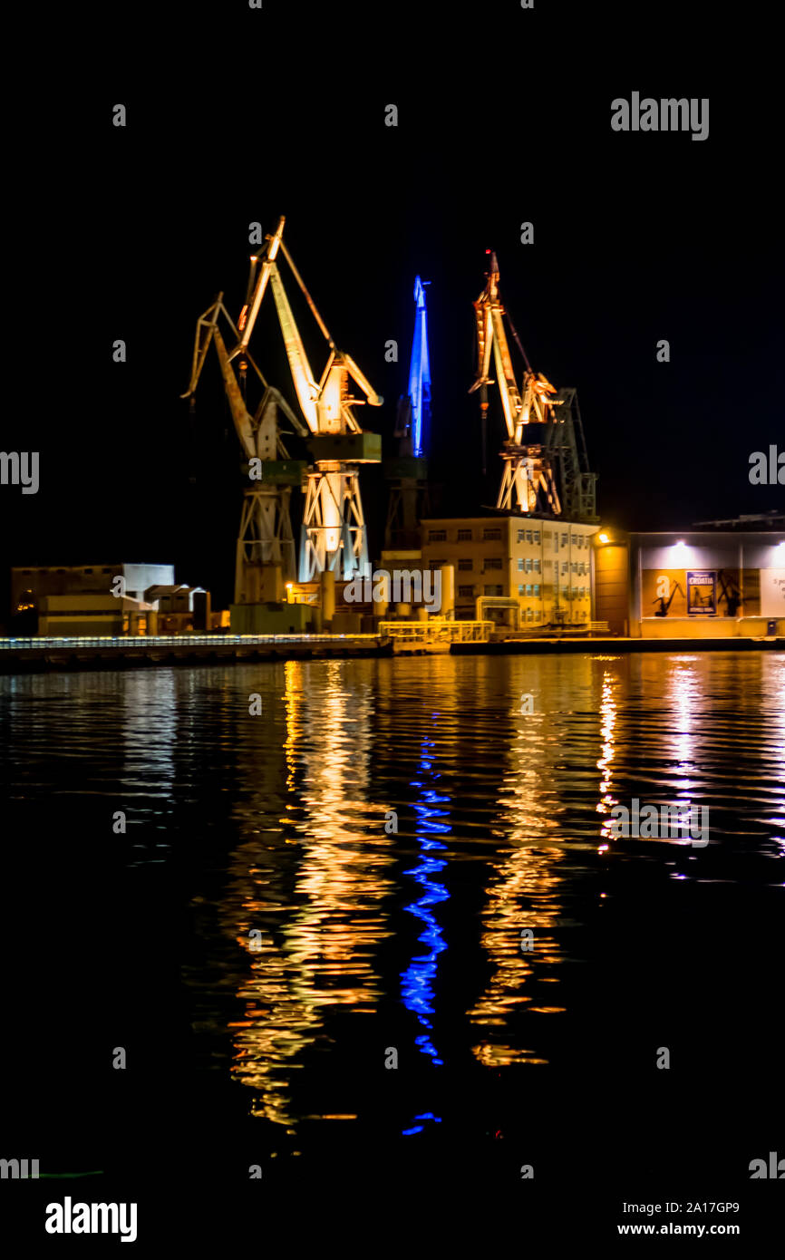 Colorful Illuminated Ship Cranes At The Harbor Docks Of Pula In Croatia ...