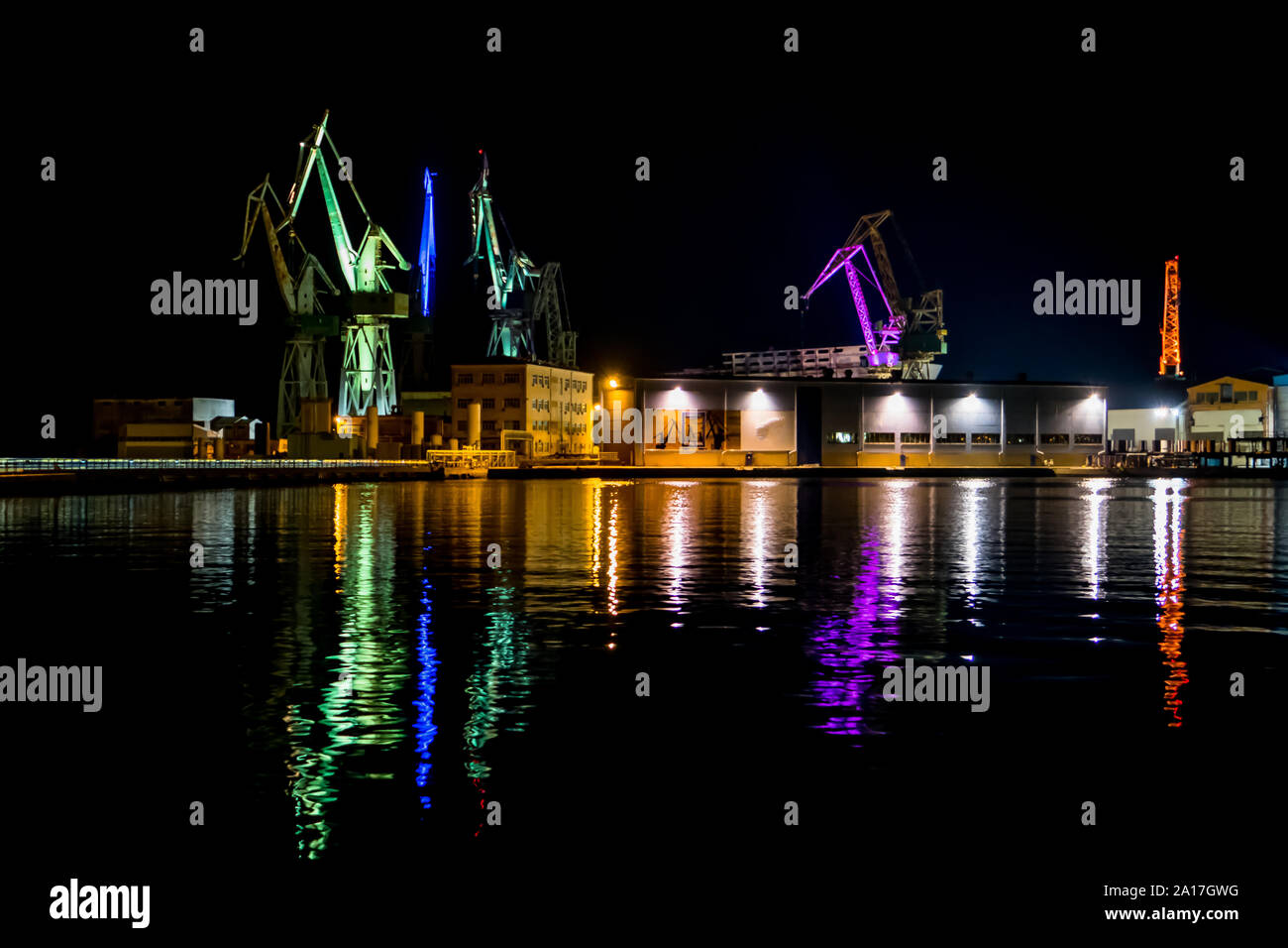 Colorful Illuminated Ship Cranes At The Harbor Docks Of Pula In Croatia ...