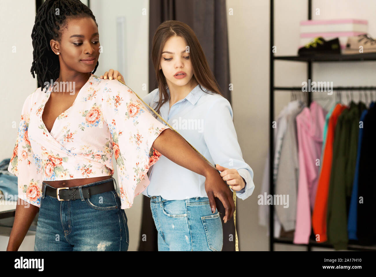 Female fashion designer measuring model hi-res stock photography and ...