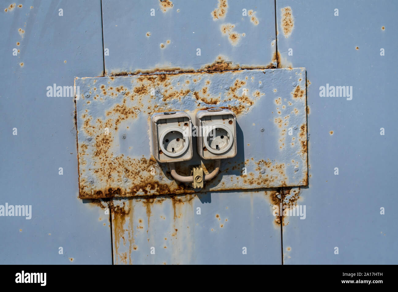 Two Old Rusty Electric Wall Sockets Stock Photo - Alamy