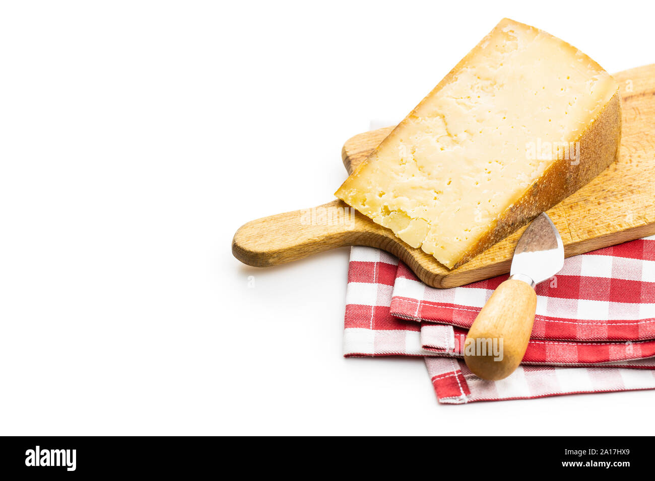 Block of tasty cheese on cutting boars and cheese knife isolated on ...