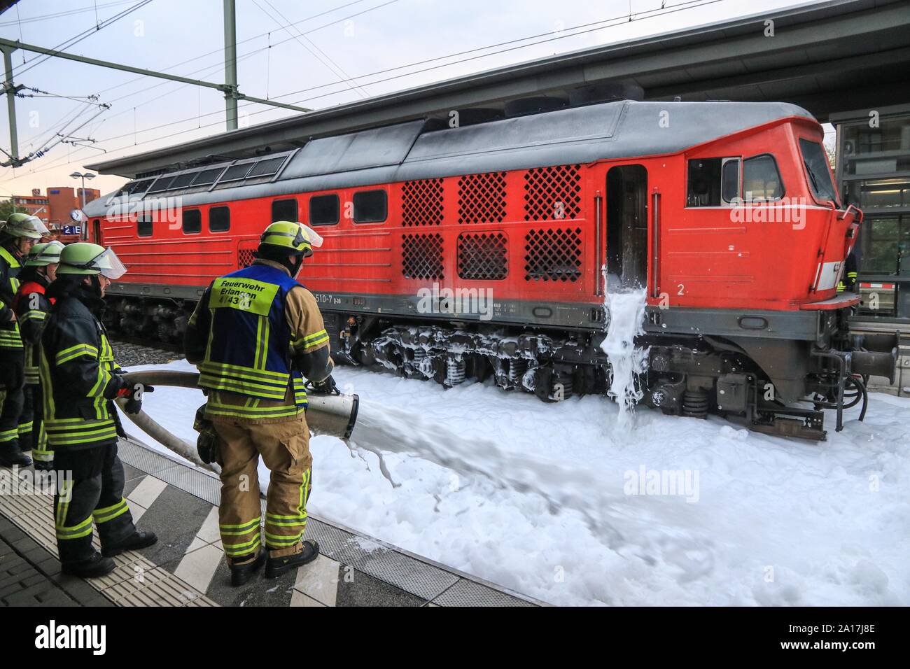 24 September 2019, Bavaria: Firefighters of the Erlangen fire brigade ...