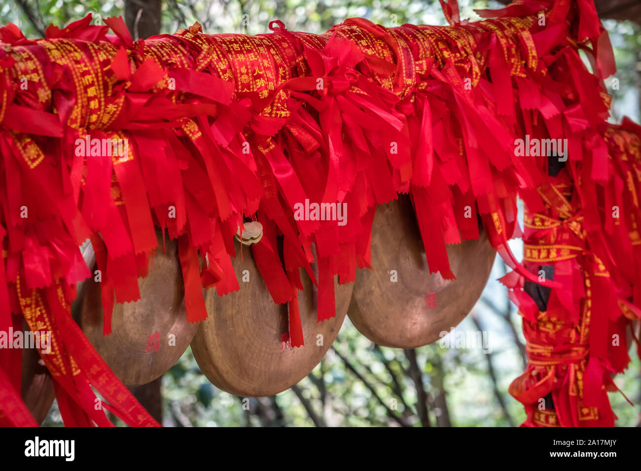 Red ribbons tied to the barriers along the walking path in Tianzi ...
