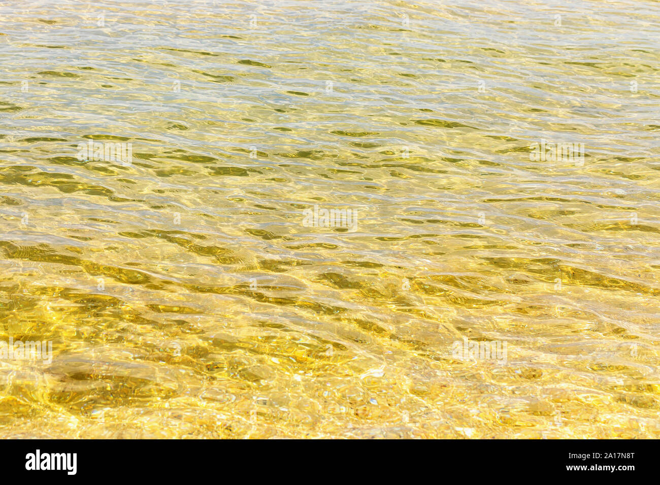 The texture of the surface of the water in the sea lit by the morning ...