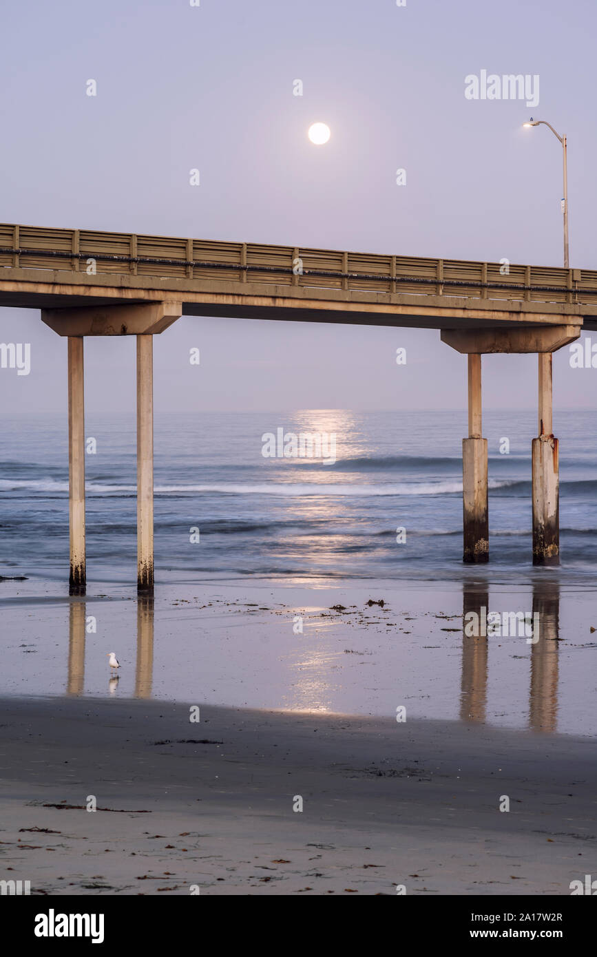 Moon Setting Over Ocean Beach High Resolution Stock Photography and ...