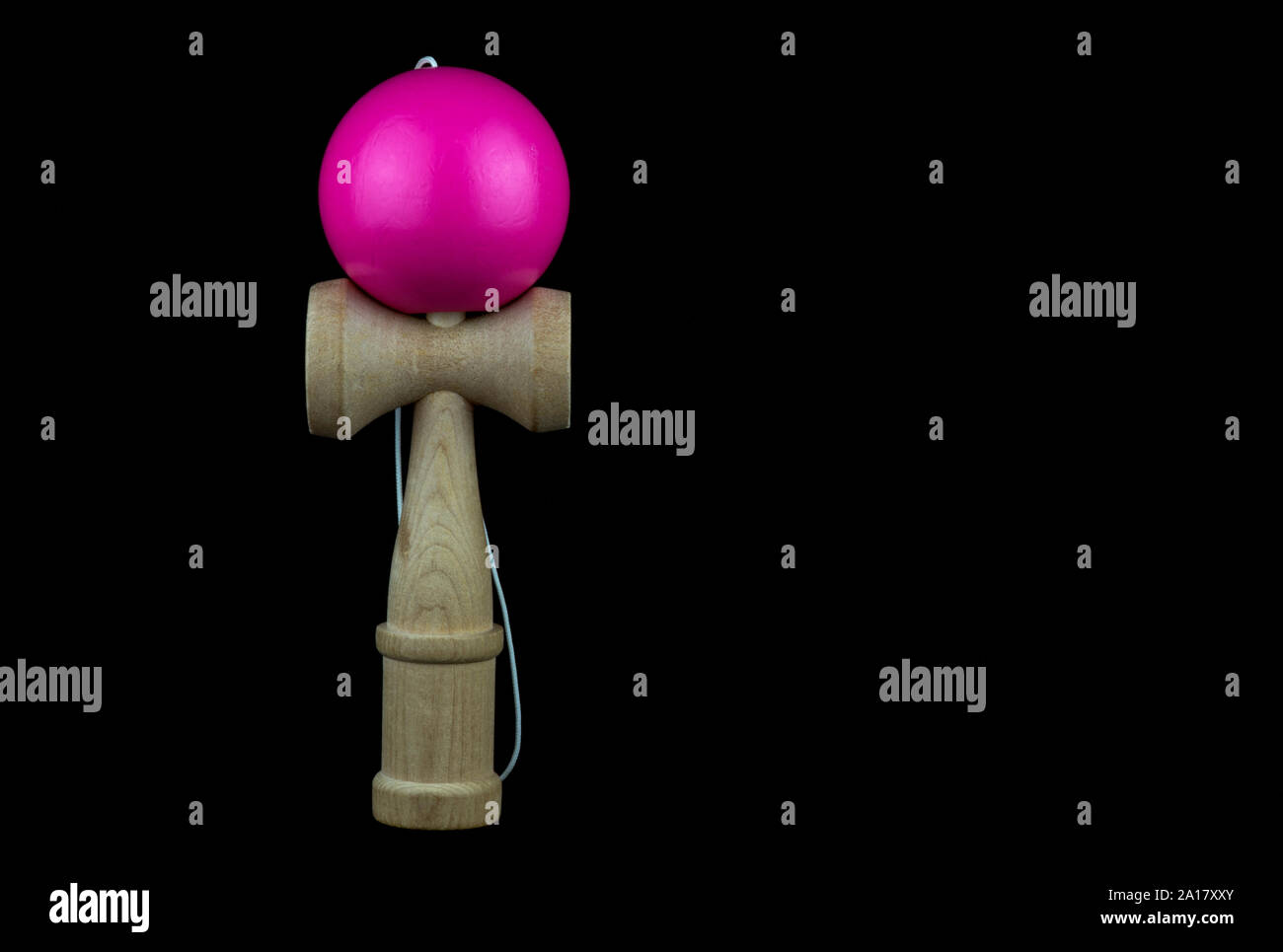 Traditional wooden toy isolated against a black background Stock Photo ...