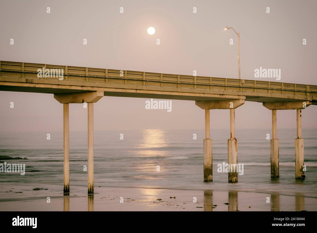 Moon setting into the sea hi-res stock photography and images - Alamy