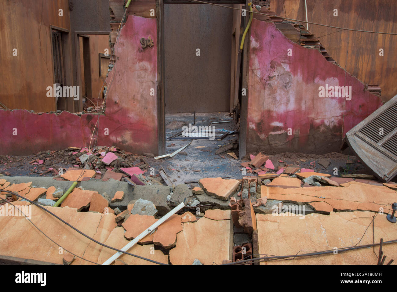 Facade of a house destroyed after a mining waste disaster Stock Photo ...