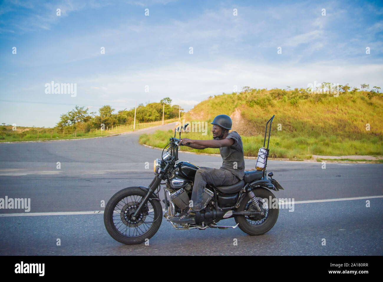 Afro-Latin man rides his motorbike in Brazilian countryside Stock Photo ...