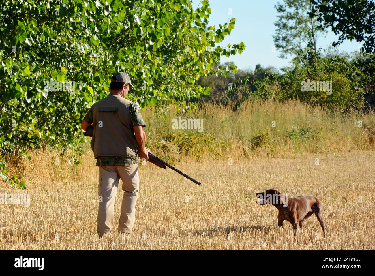 a hunter with a dog Stock Photo - Alamy