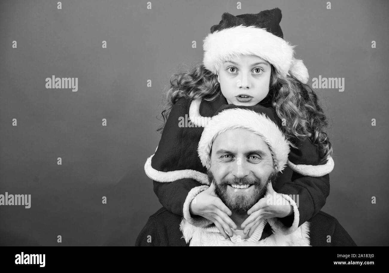 Christmas family tradition. Dad in santa costume and daughter cute kid ...
